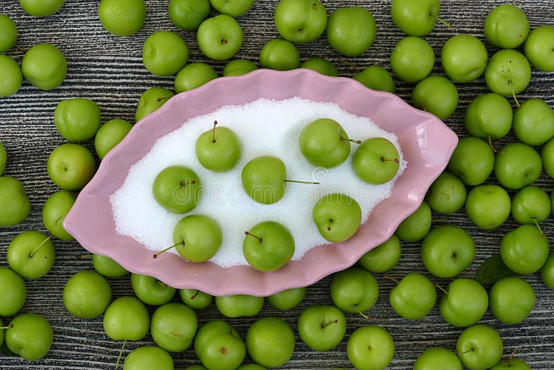Green Fresh Sour Plums and Salt in the Dish, Sour Plums with Salt Stock ...