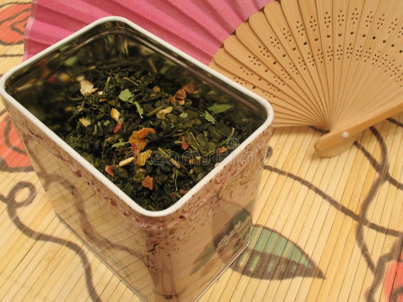 Green Fruit Tea in Tin and Chinese Fan Stock Image - Image of taste ...