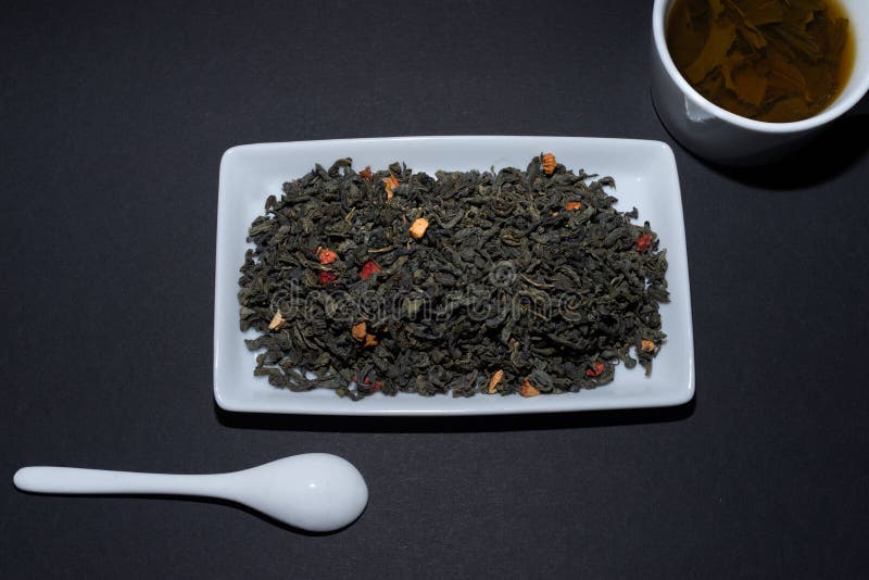 Green Fruit Tea in White Plate on Dark Background. Top View with a Copy ...
