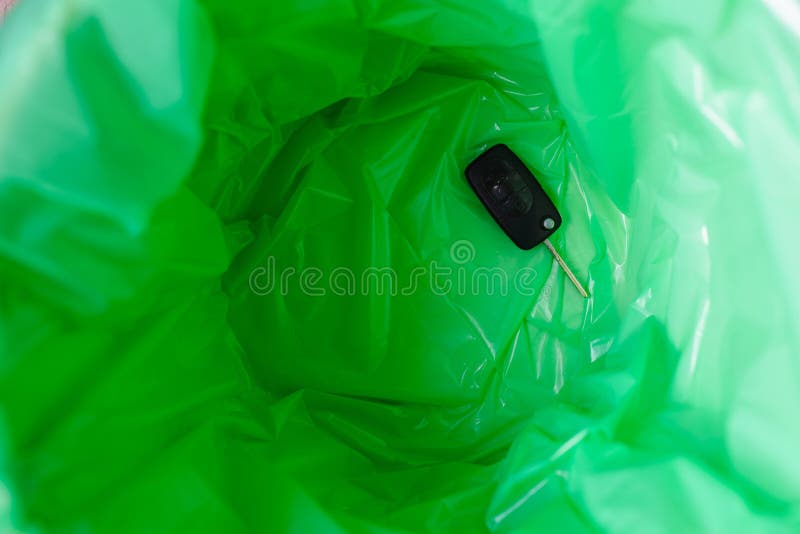 A Green Garbage Bag in the Trash. There is an Auto Key Inside Stock ...