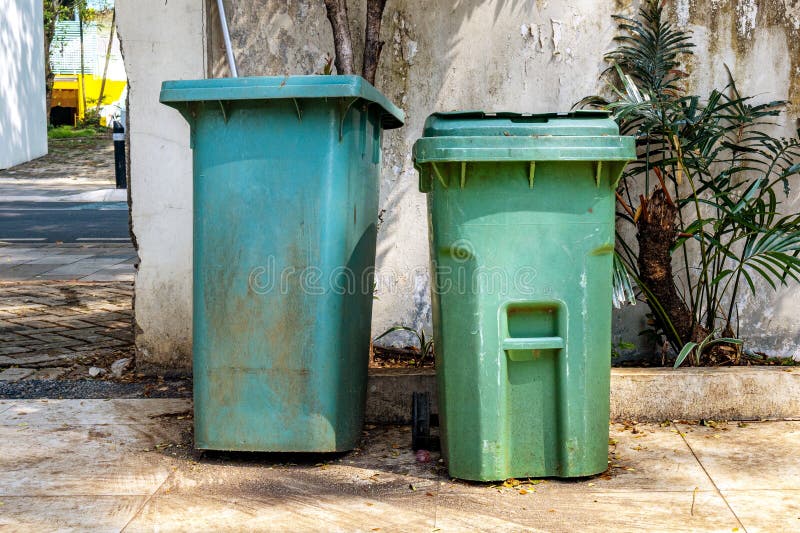 Green garbage bins stock image. Image of garbage, outdoor - 299502573