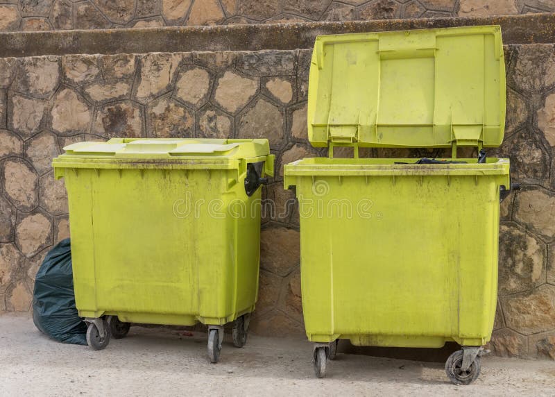 Green Garbage Containers Near the Wall Stock Photo - Image of ...