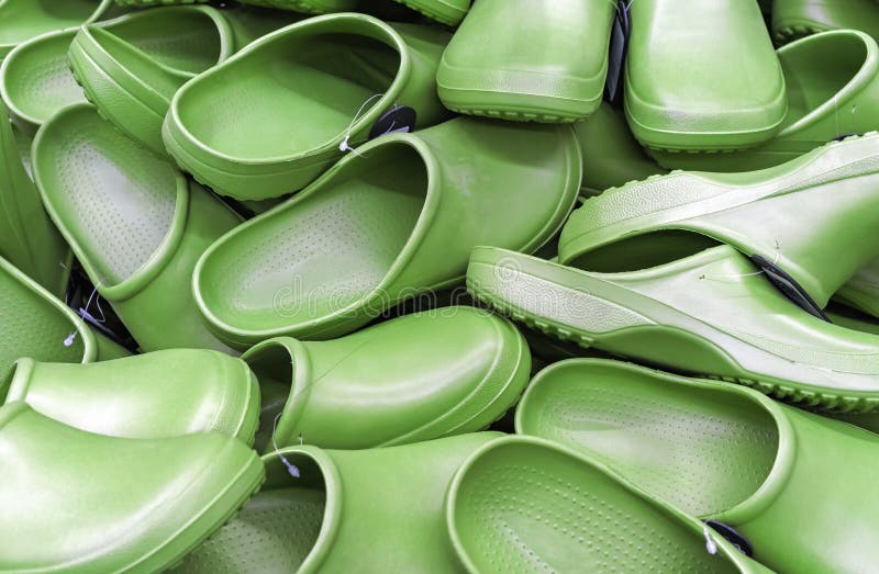 Green Garden Shoes Clogs on the Counter of the Store Stock Image ...