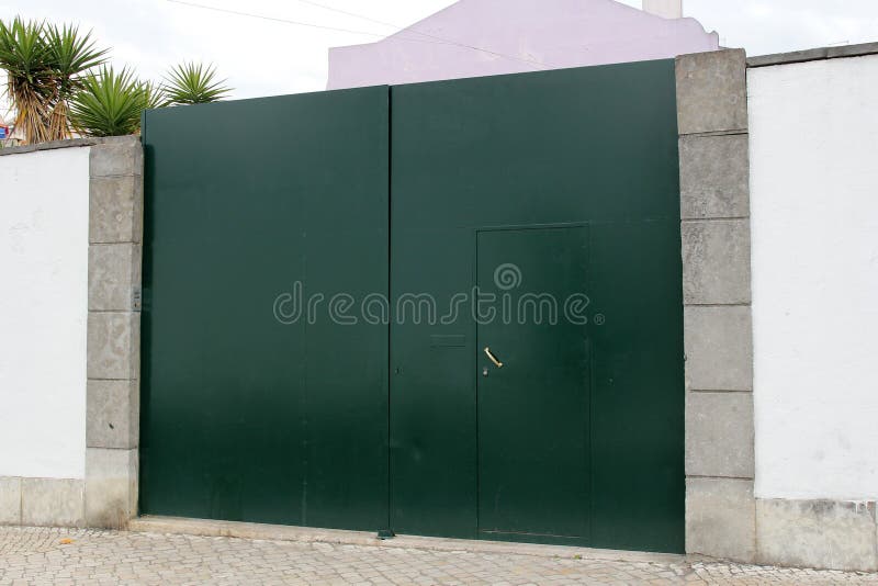 Green gate in white wall stock photo. Image of green - 110162102