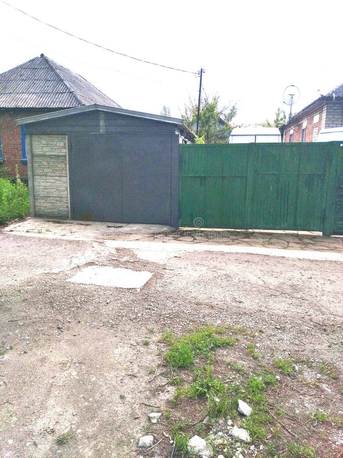 Green Gates and Garage of the Private House Stock Photo - Image of road ...