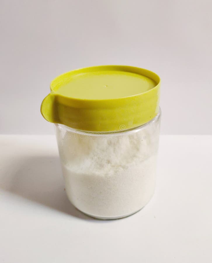 Glass Containers Filled with Salt and Its Lid on White Background Stock ...