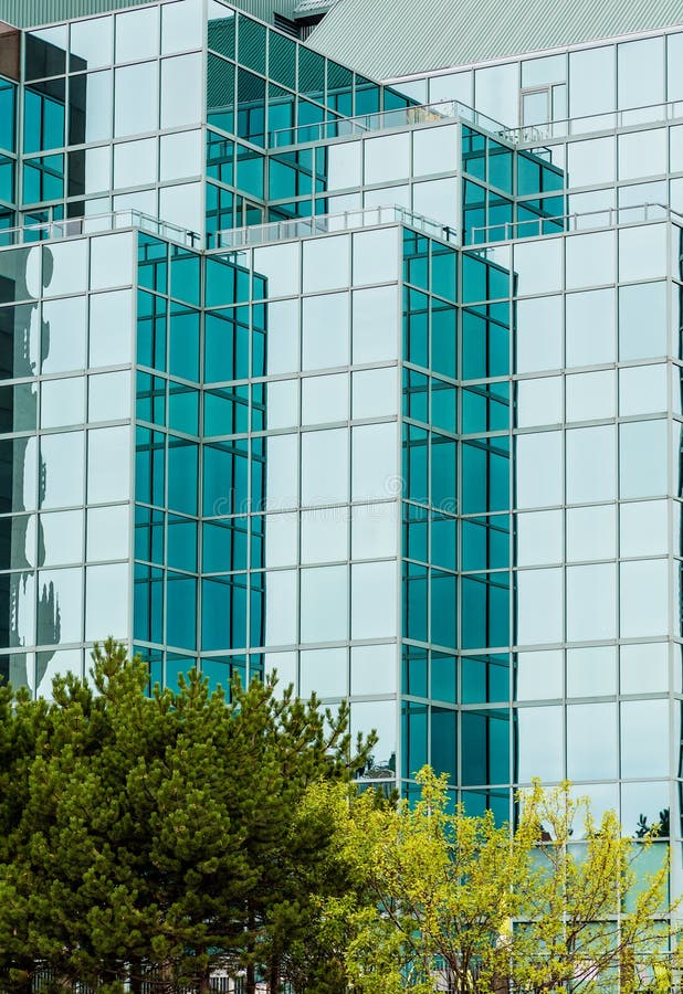Green Glass in Modern Angled Building Stock Image - Image of glass ...
