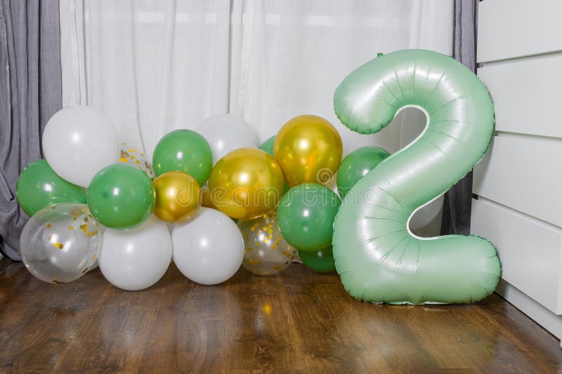 Green and Gold Balloon Arrangement with Large Number Two Stock Image ...