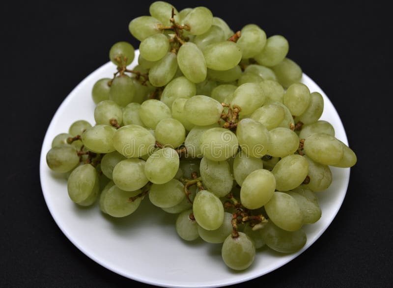 Green Grapes on a White Plate. Bunches of Green Grapes Stock Image ...