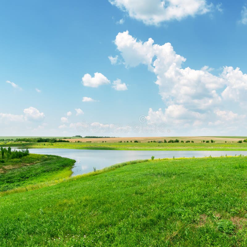 Green Grass and River Under Blue Sky Stock Photo - Image of hill, scene ...