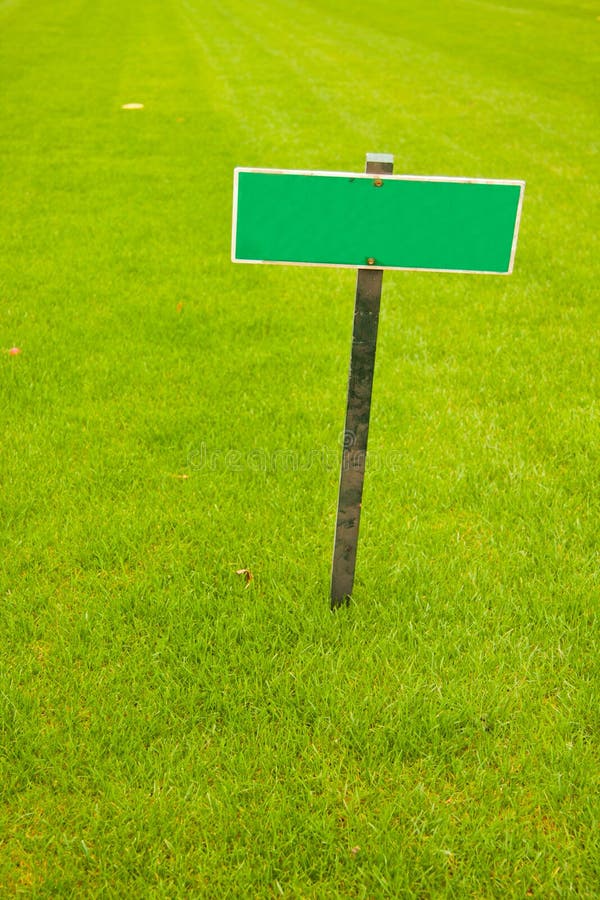 Green Grass with a Sign, Vertical Shot Stock Image - Image of ...