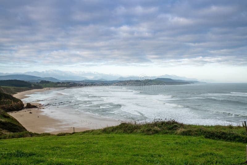Green Grassy Cliffs Drop Down To the Ocean Coast and a Large Beautiful ...