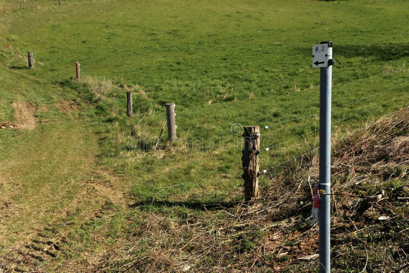 Green Grassy Path with a Direction Sign for Hikers Stock Image - Image ...
