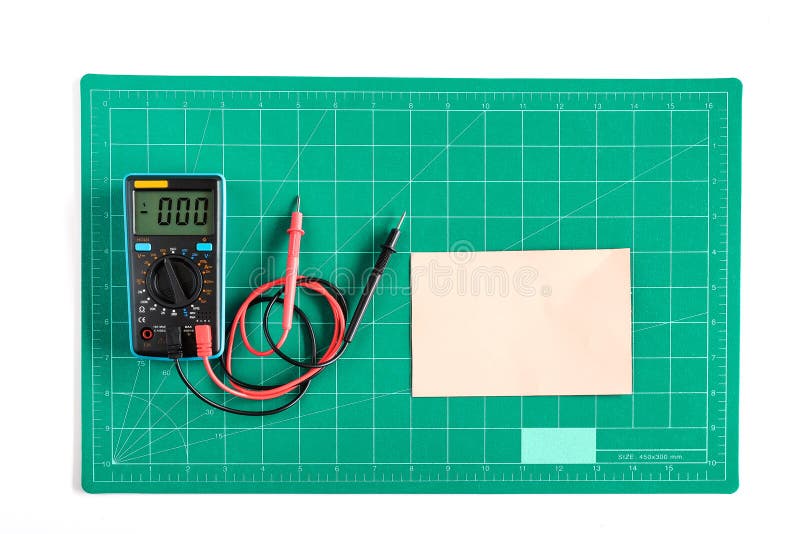 Green Grid Cutting Matt or Pad with Voltmeter Work Tool Stock Image ...
