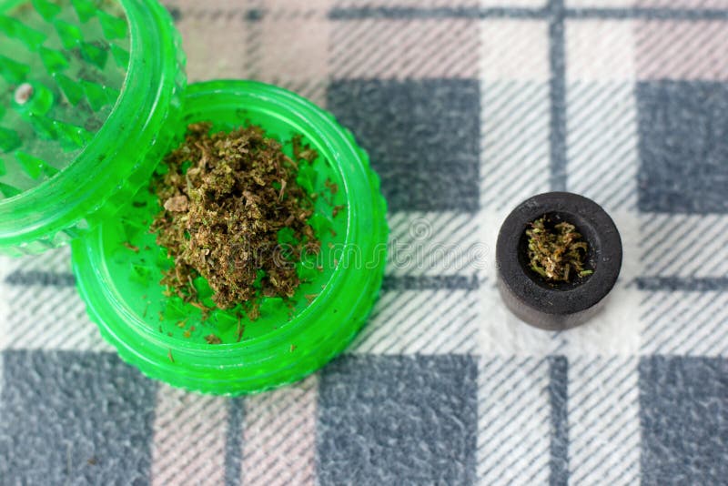 Green Grinder for Grinding Marijuana, Fresh Cut Cannabis Stock Image ...