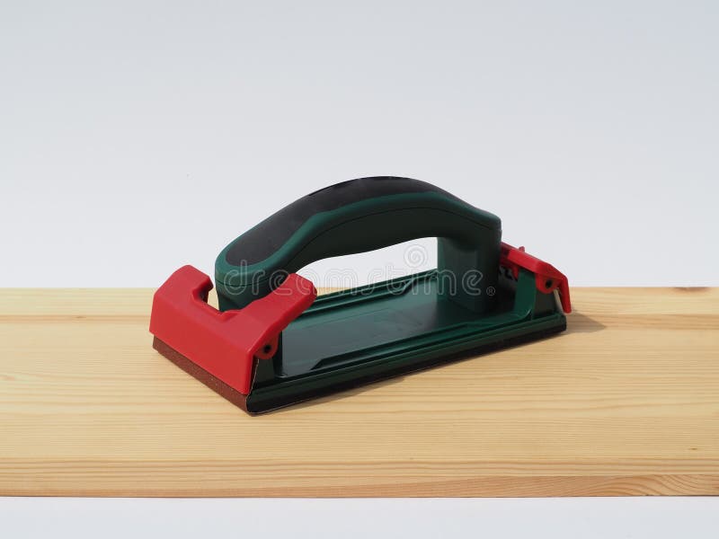 Green hand sander on board stock image. Image of board - 282996487