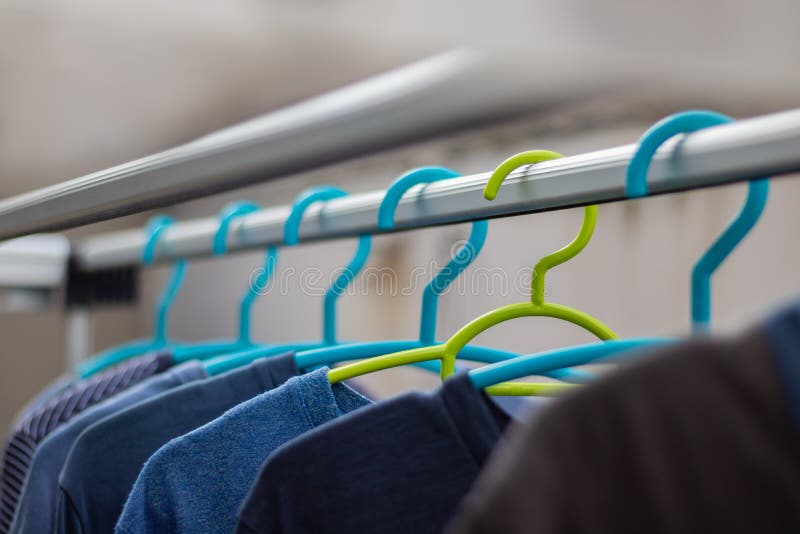 Green Hanger Plastic in the Clothes Array with a Blue Hanger Plastic ...