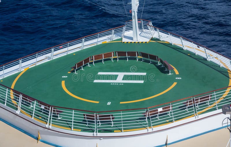 Green Helicopter Pad on Deck of Ship Stock Photo - Image of water, blue ...