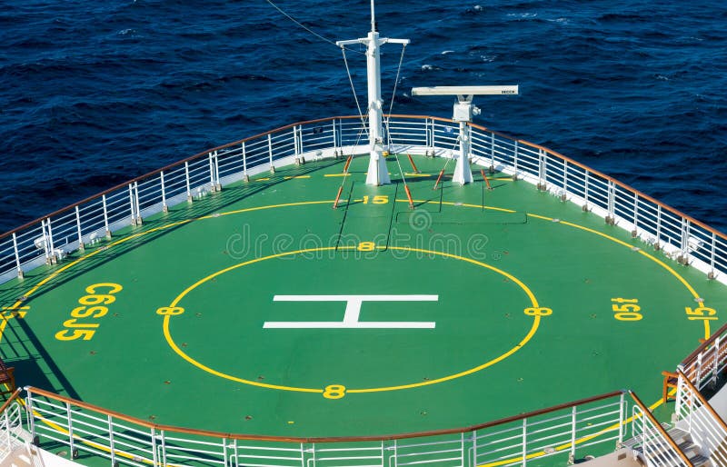 Green Helicopter Pad on Deck of Ship Stock Photo - Image of water, blue ...