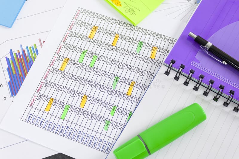 Green Highlighter and Notepad Laying on a Spreadsheet Stock Photo ...
