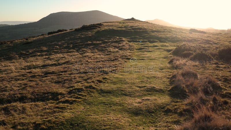 Green Hills with Grass with the Sun Shining Stock Image - Image of ...