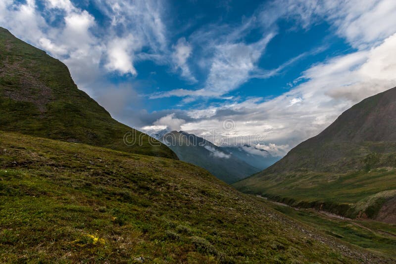 Green Hillside and Valley between the Mountains. Stock Image - Image of ...