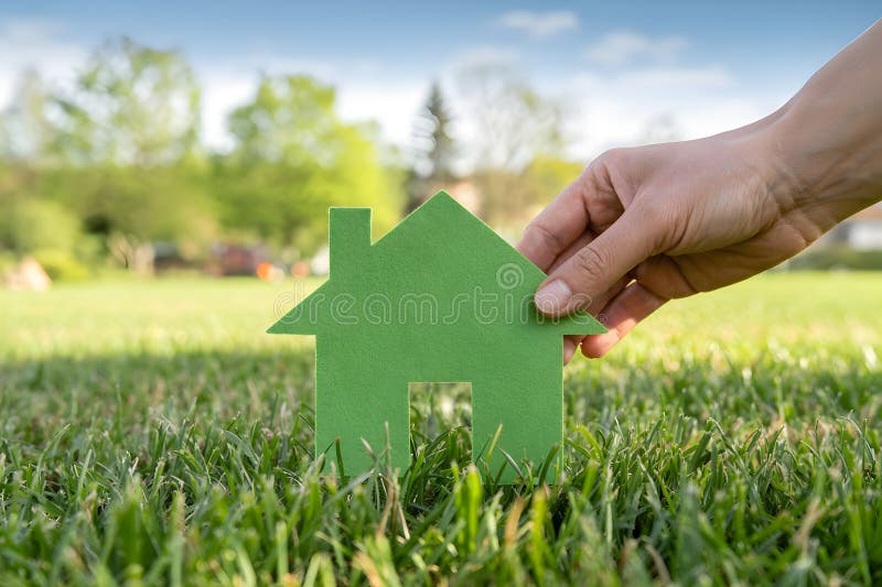 Green House Held on Grass, Real Estate Concept for Eco Friendly Home or ...