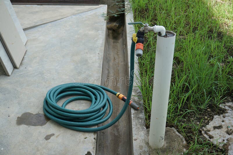 A Green Hose is Connected To a White Pipe Stock Image - Image of color ...