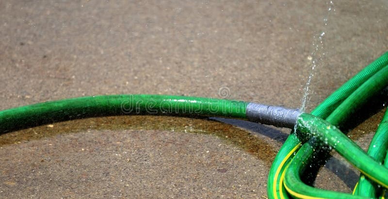 Green Hose Leaking Spraying Water Stock Photo - Image of broke, break ...