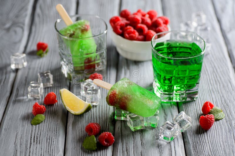 Green Ice Cream Popsicle with Lime and Raspberry Stock Photo - Image of ...