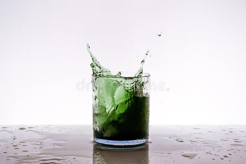 Green Iced Cocktail Splash on the Table on a White Background Stock ...