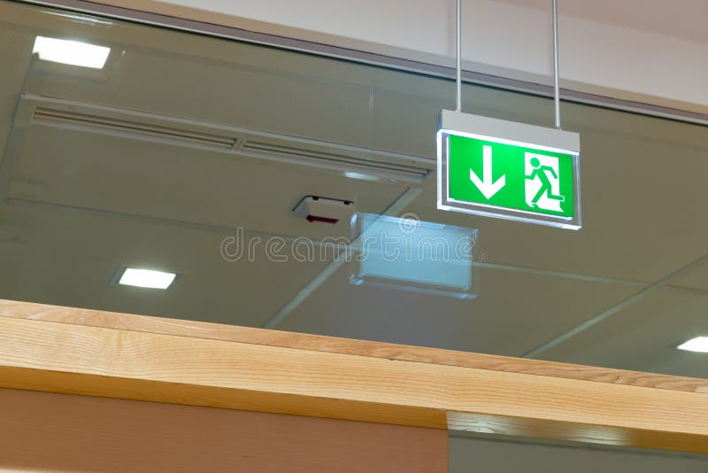 Green Illuminated Exit Sign Stock Photo - Image of directional, doorway ...