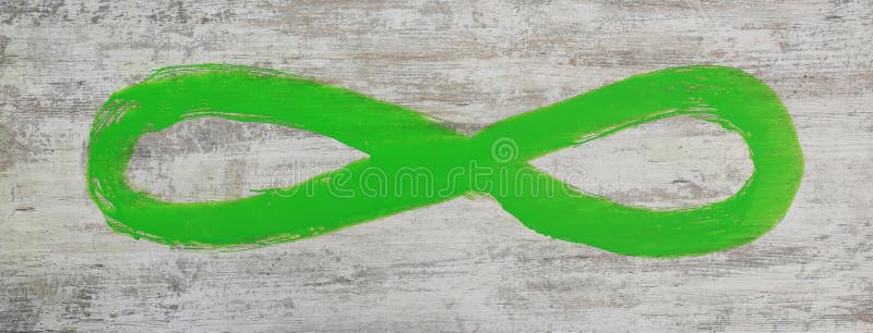 Green Infinity Sign on Wooden Wall Stock Image - Image of loop ...