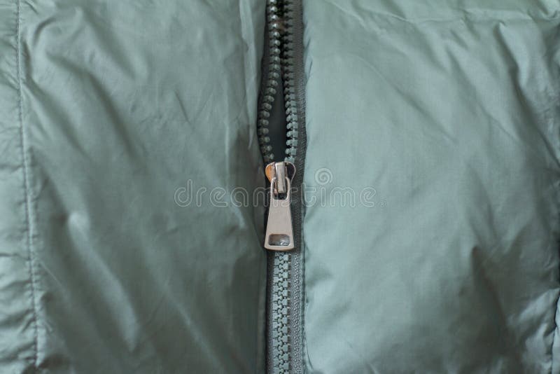 The Green Jacket is Fastened with a Plastic Zipper, Close-up. Stock ...