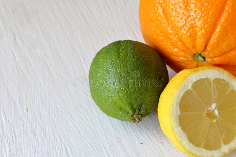 Green Juicy Lime, Orange and Half a Lemon. on a Shabby Aged Background ...