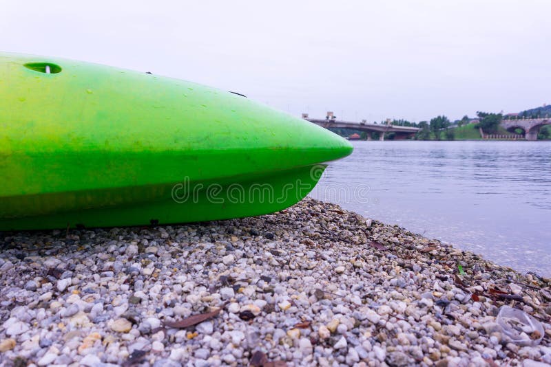 Green Kayak by the Lake Side Stock Image - Image of paddle, outdoors ...
