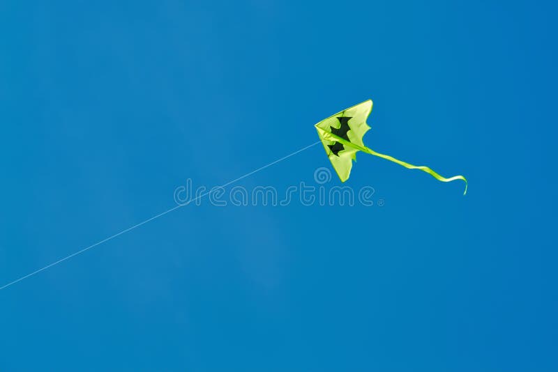 Green Kite Flying in Clear Blue Sky Stock Photo - Image of leisure ...