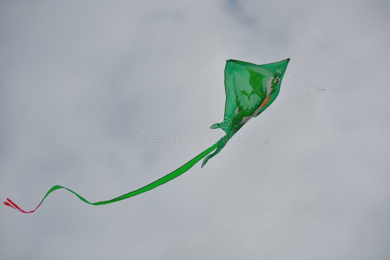 Green Kite Flying in Cloudy Autumn Sky Stock Photo - Image of nature ...