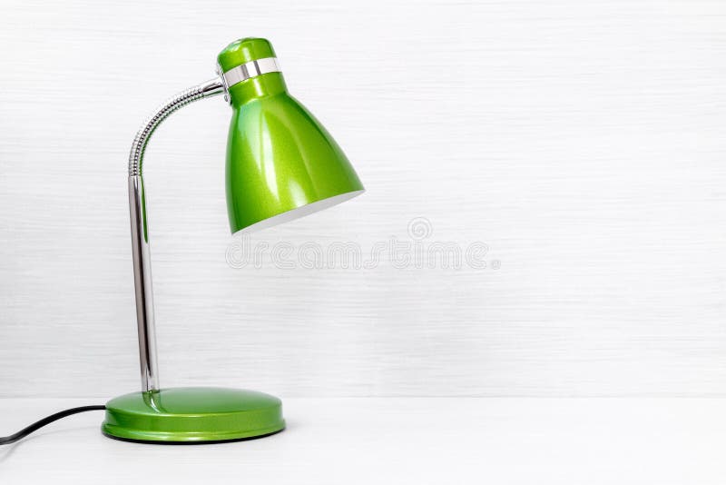 Green lamp on wooden desk stock photo. Image of desktop - 125451040
