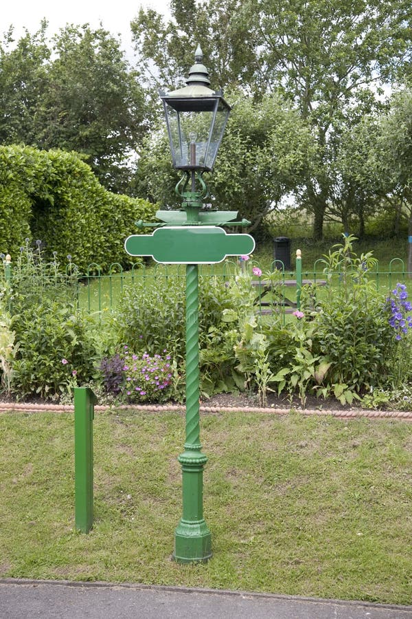 Green Lamppost on Blue Wall Stock Image - Image of wall, light: 69520851