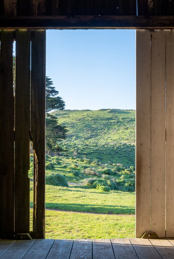 Green Landscape from Inside Doorway of Rustic Barn Stock Image - Image ...