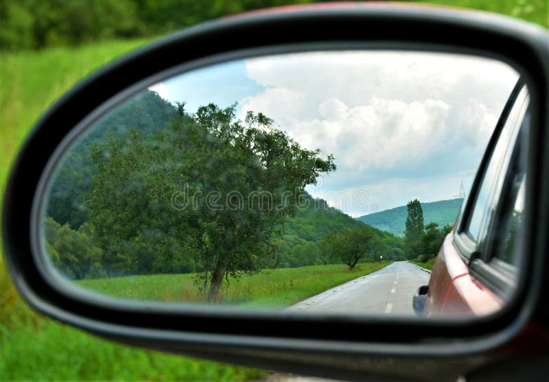 Green Landscape Seen through the Rearview Mirror of the Car Stock Image ...