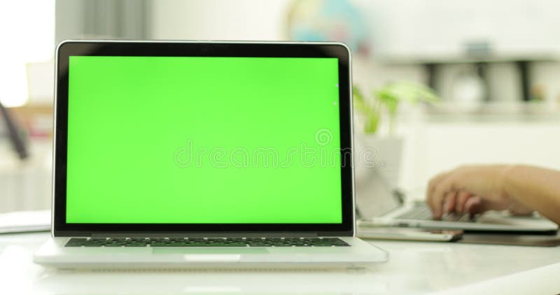 Green Laptop Computer Screen Set in Front of Workgroup Stock Footage ...