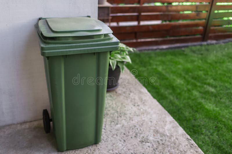 Green Large Plastic Bin for Trash on Backyard Stock Image - Image of ...