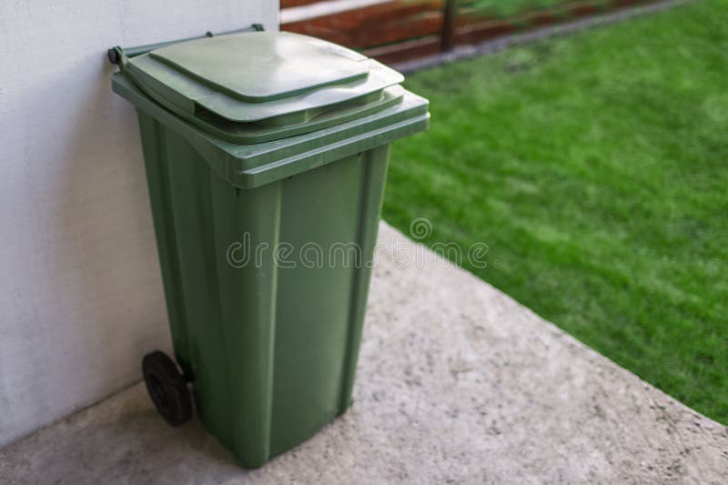 Green Large Plastic Bin for Trash on Backyard Stock Image - Image of ...