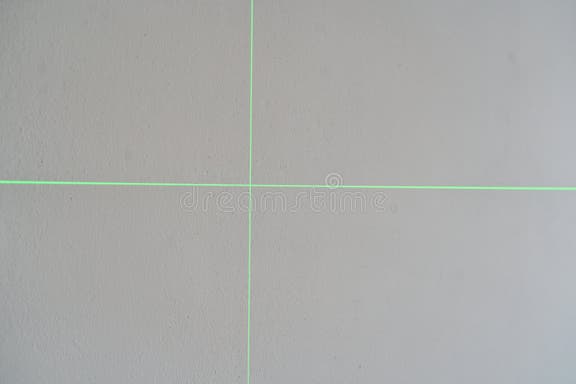 Green Laser Cross Projection on Smooth Wall for Alignment Stock Photo ...