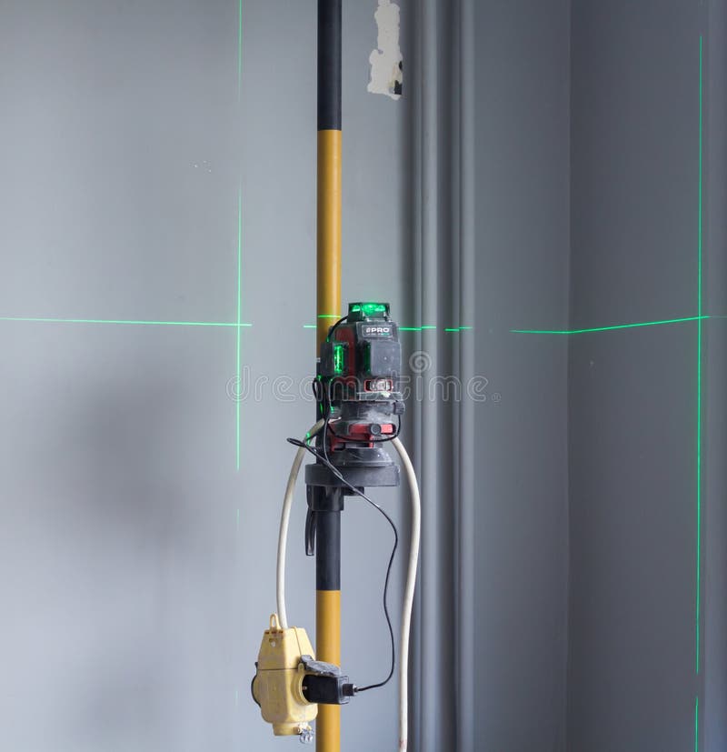 Green Laser Level Mounted on Telescopic Pole during Interior Wall ...