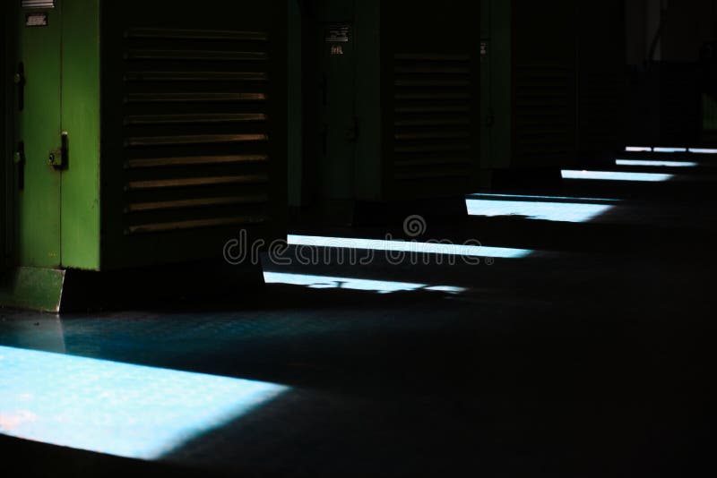 Green Lathes in the Empty Dark Industrial Place with Light Shadows ...