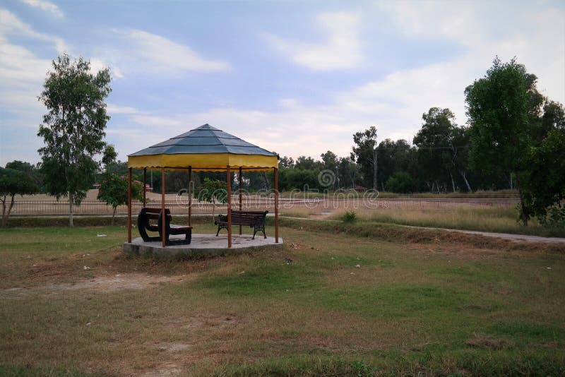 Green Lawn with Trees and Sitting Hut in Park, Selective Focus, Blue ...