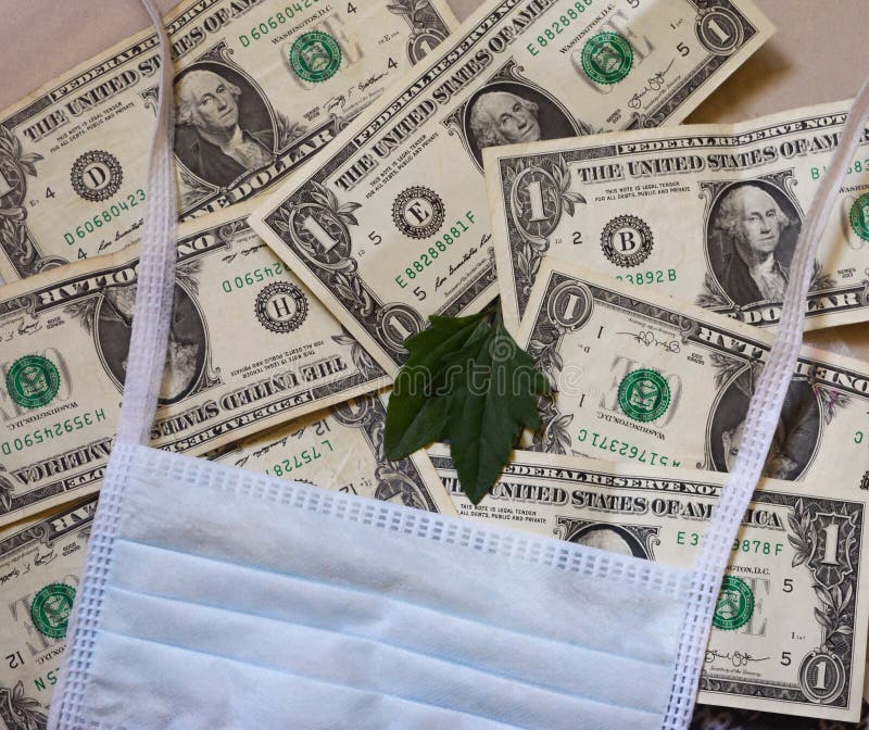 Green Leaf and Face Mask Lying on the American Dollar Bank Note. Stock ...